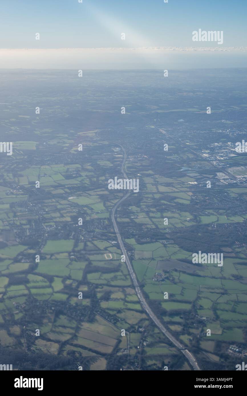 Aerial view of London outskirts suburbs from an aeroplane window ...