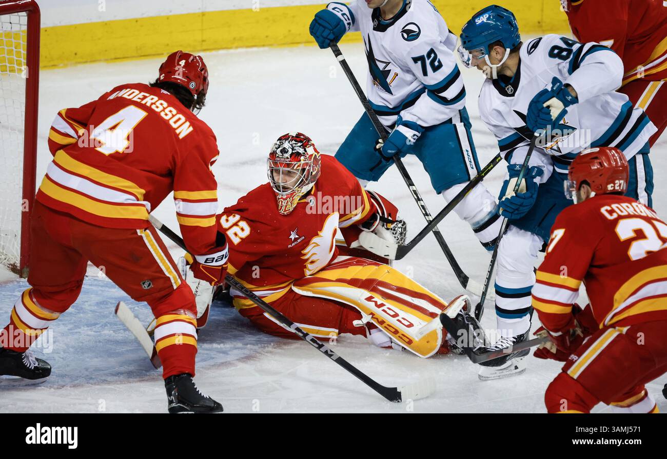 San Jose Sharks' Jan Rutta (84) scores on Calgary Flames goalie Dustin ...