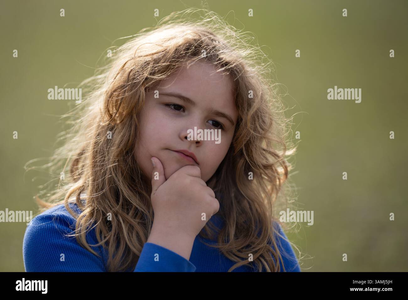 Child daydream in nature. Blonde child thinking peacefully. Little ...
