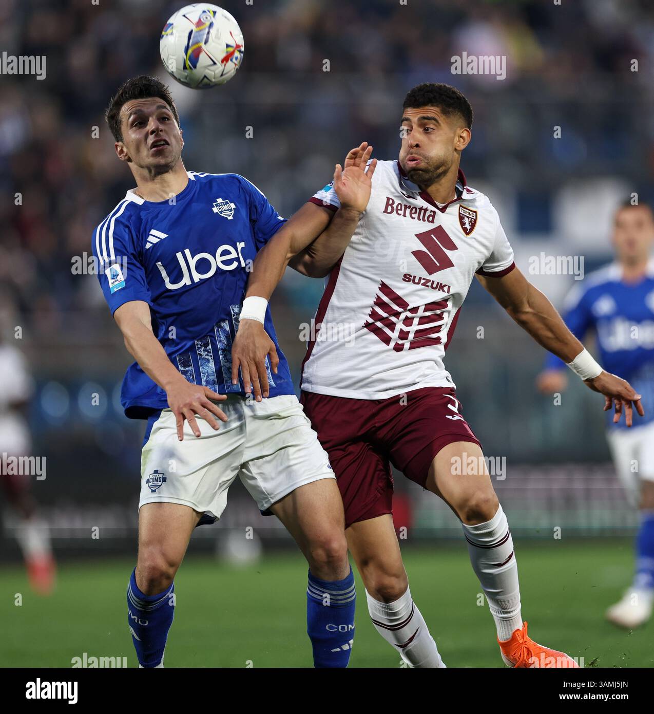 Como, Italy. 13th Apr, 2025. Como's Anastasios Douvikas (L) vies with ...