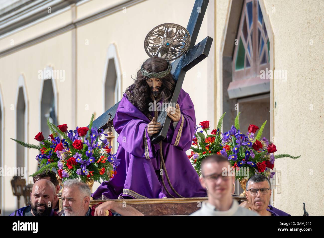 Participants carry a religious float during the Holy Week procession of ...