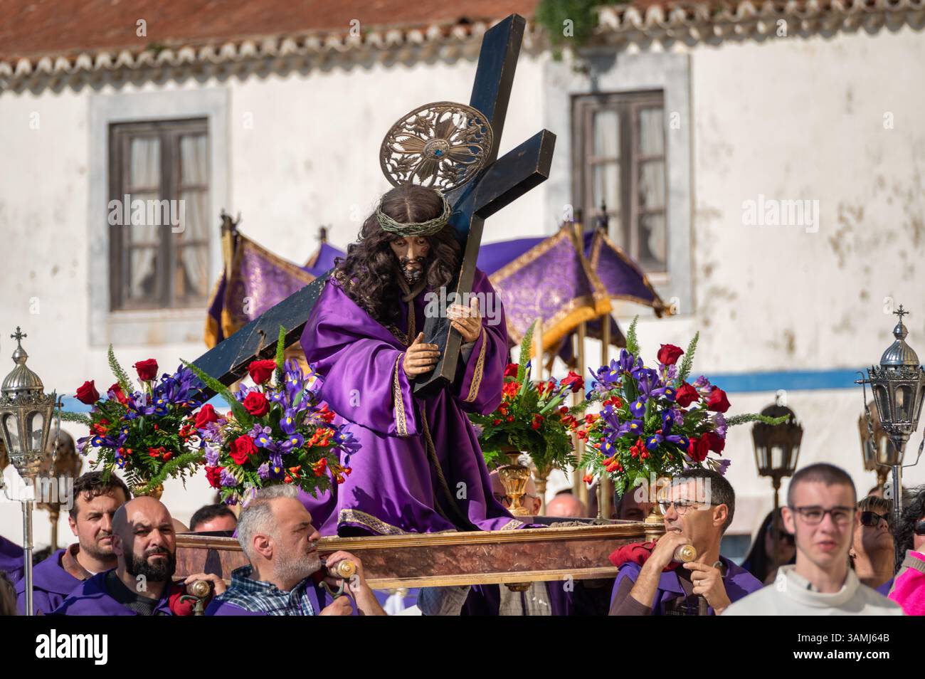Participants carry a religious float during the Holy Week procession of ...