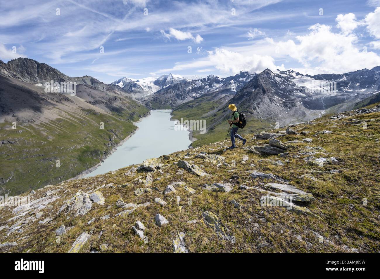 Mountaineer on the summit of Mont de la Blana, view of a blue mountain ...
