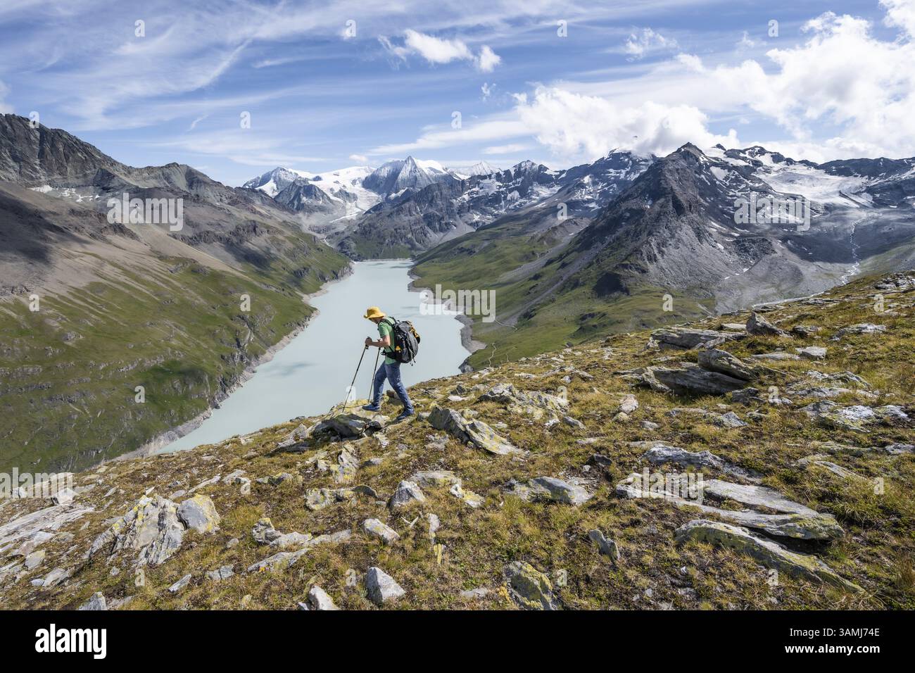 Mountaineer on the summit of Mont de la Blana, view of a blue mountain ...