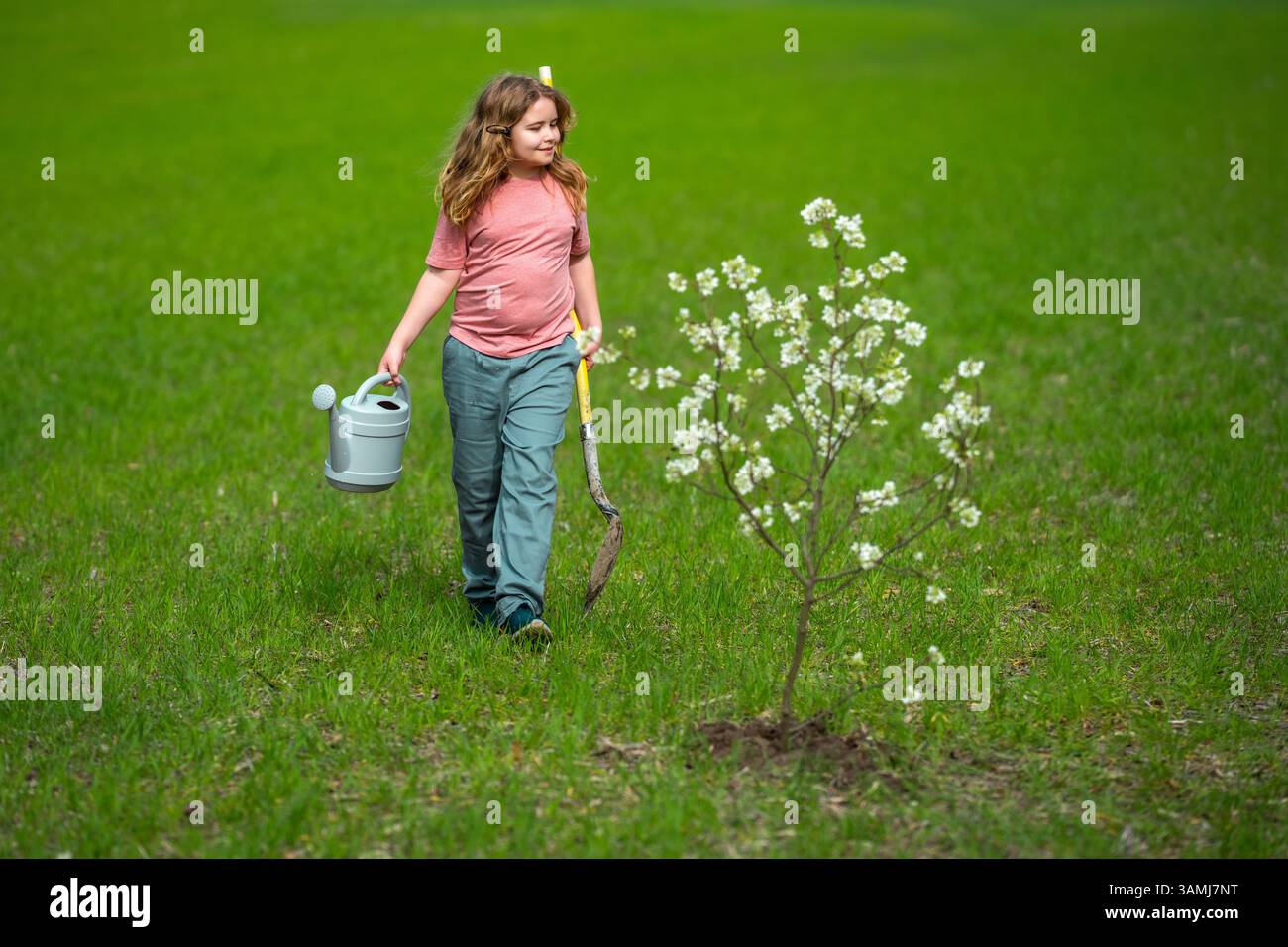 Child gardener planting tree in spring garden. Spring activity of plant ...