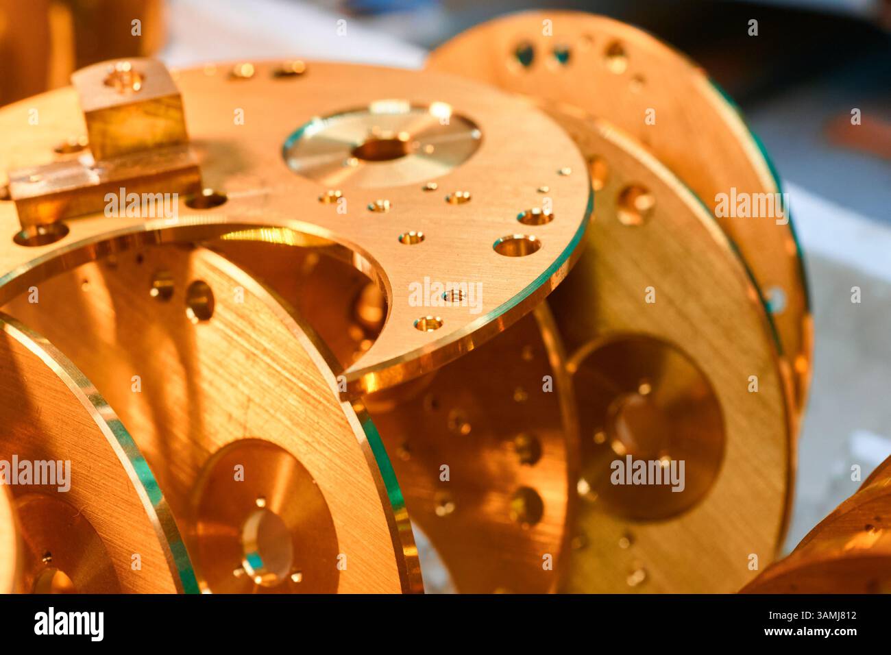 Intricate watch mechanism bases showcased in a metalworking workshop ...