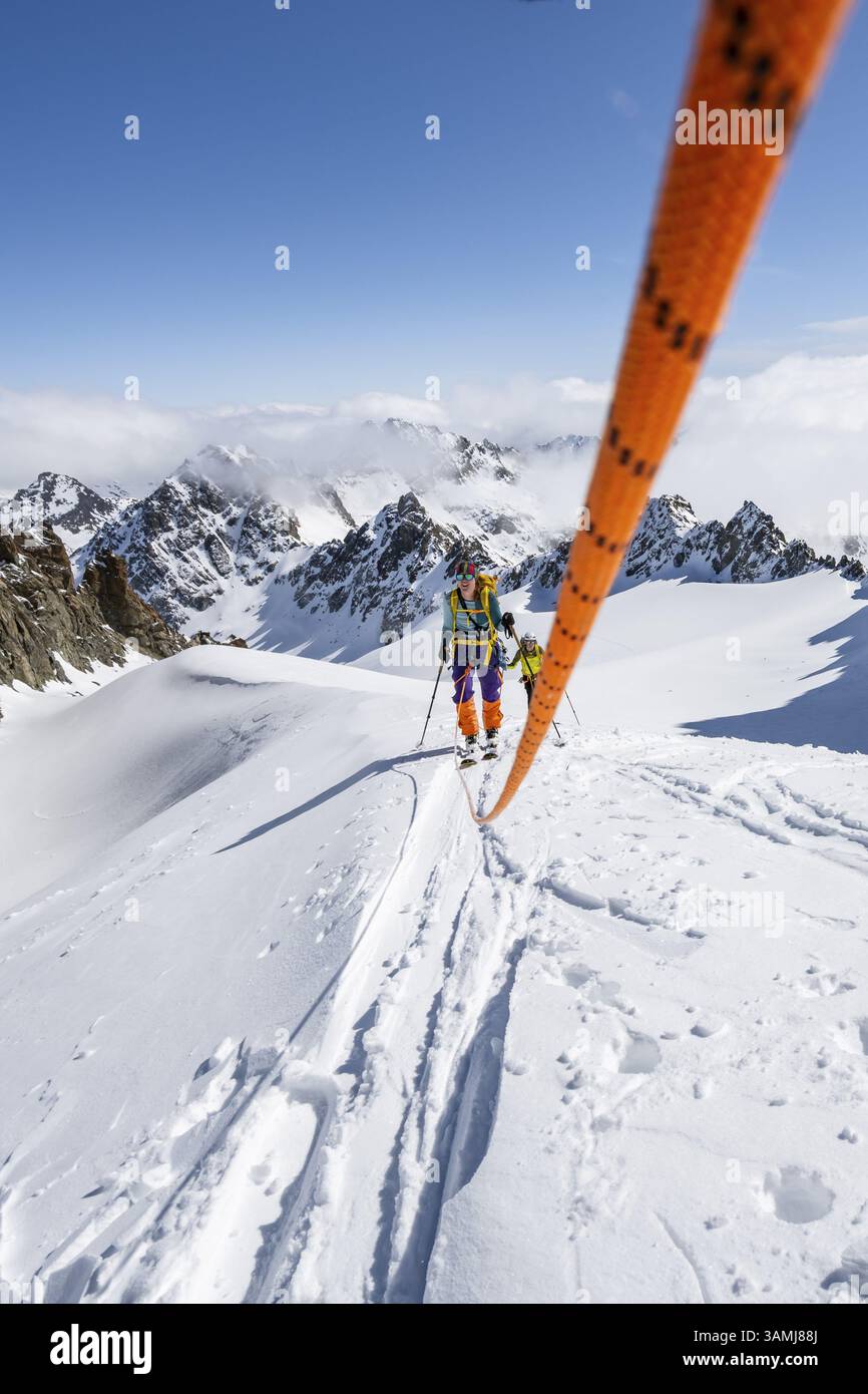 Ski tourer with rope, rope team on the Vadret da Porchabella glacier on ...