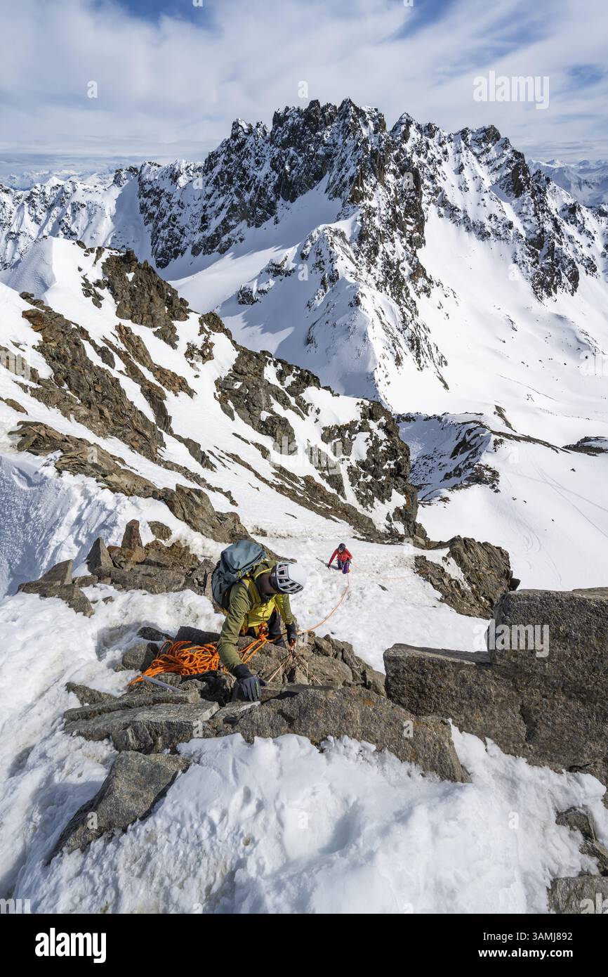 Alpinists hiking in snowy mountains hi-res stock photography and images ...