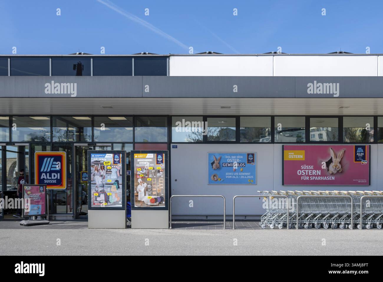 Aldi entrance advertising posters Stock Photo - Alamy