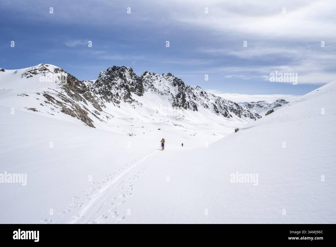 Ski tourer in mountain landscape with snow, ascent to Grialetsch ...