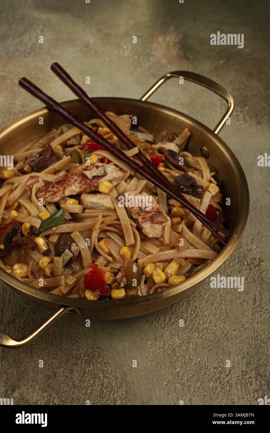 Fried noodles with chicken meat and vegetables, Bami Goreng, an ...