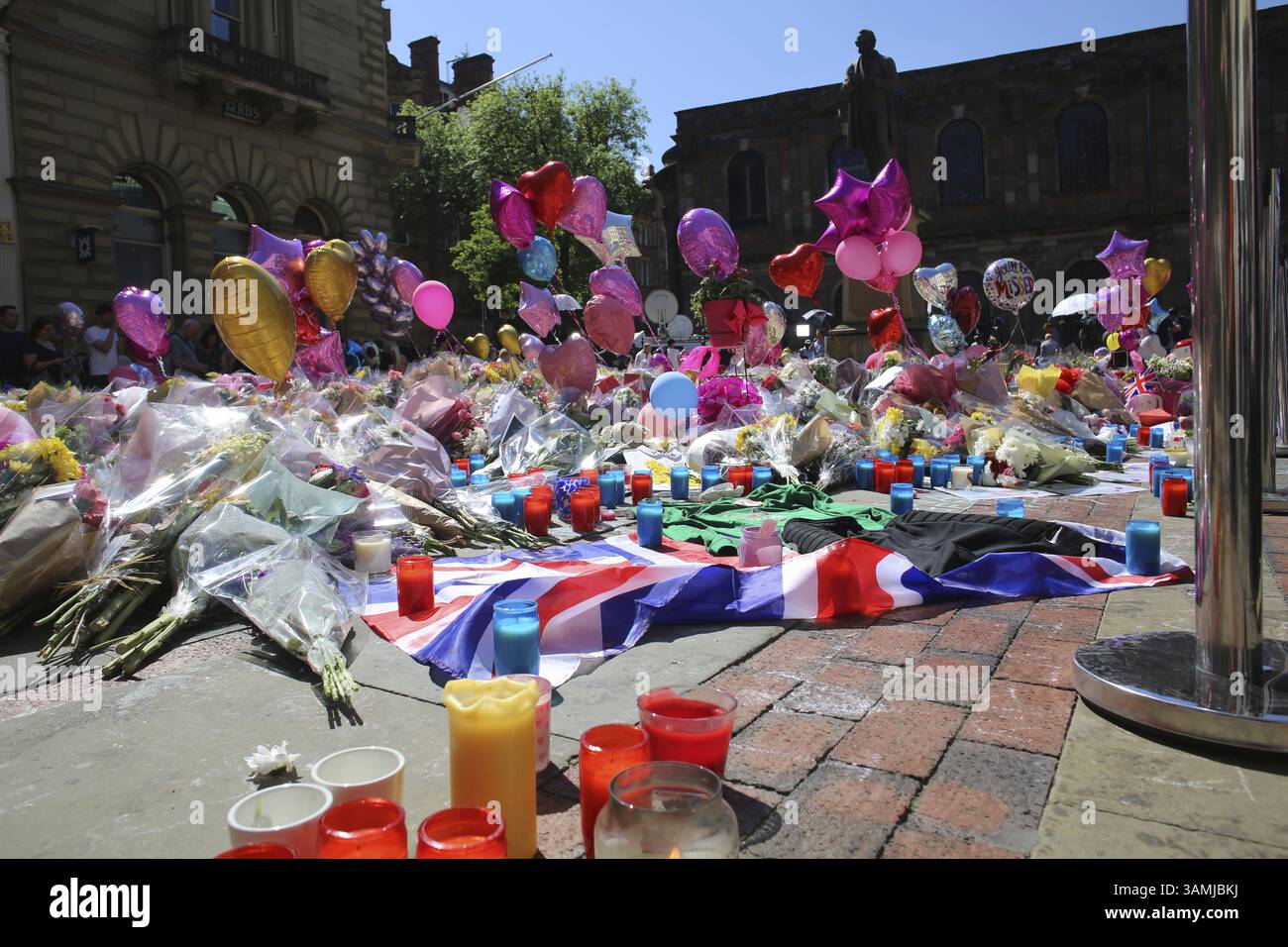 Part of the floral tribute as people in St. Ann's Square, Manchester ...