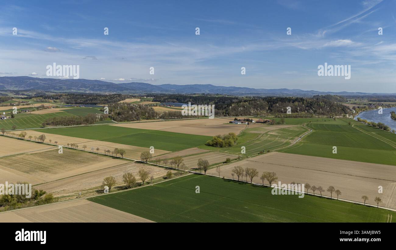 Rural landscape with green fields, a river (Danube) and a blue sky in ...