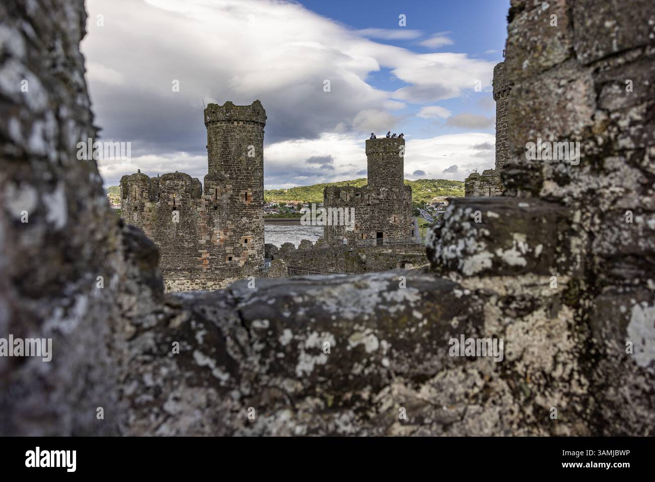 Conwy Castle, view through a weathered opening in the castle wall to ...