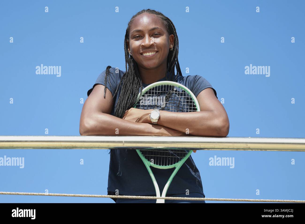 American tennis player Coco Gauff clutching her racket leaning on ...