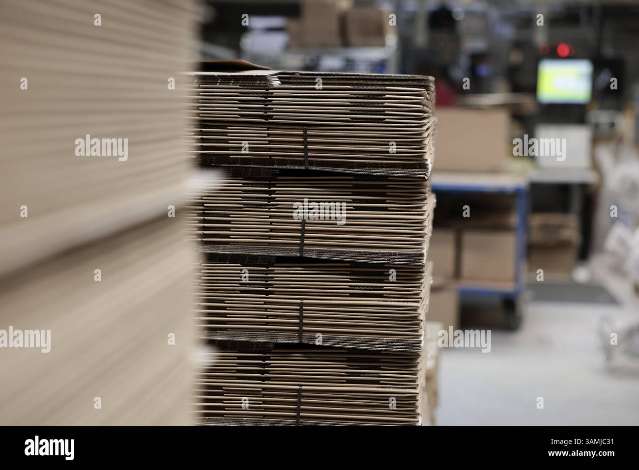 Stack of cardboard boxes, stacked flat boxes for shipping in a ...