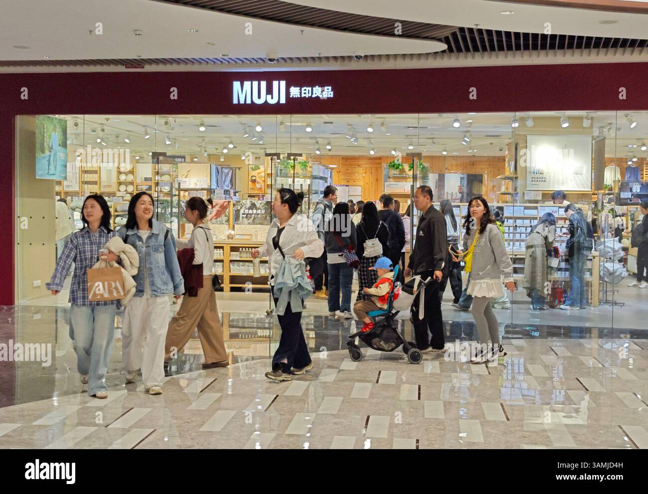 JINAN, CHINA - APRIL 6, 2025 - Customers shop at a Muji store in Jinan ...