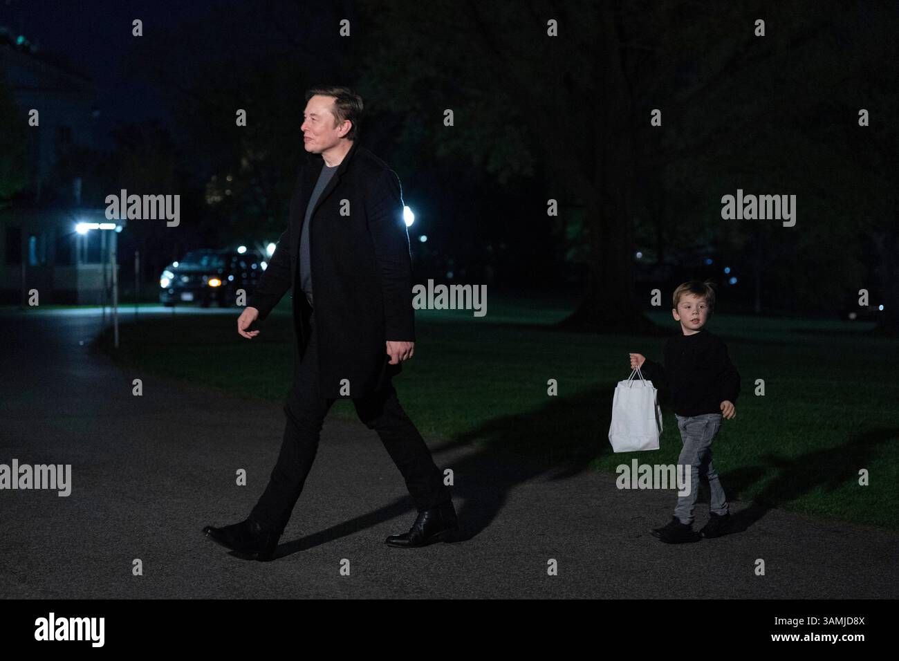 Elon Musk and his son X Æ A-Xii walk on the South Lawn upon their ...