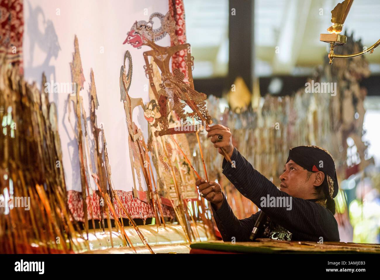 Beijing, Indonesia. 9th Jan, 2025. A puppeteer performs Wayang Kulit at ...