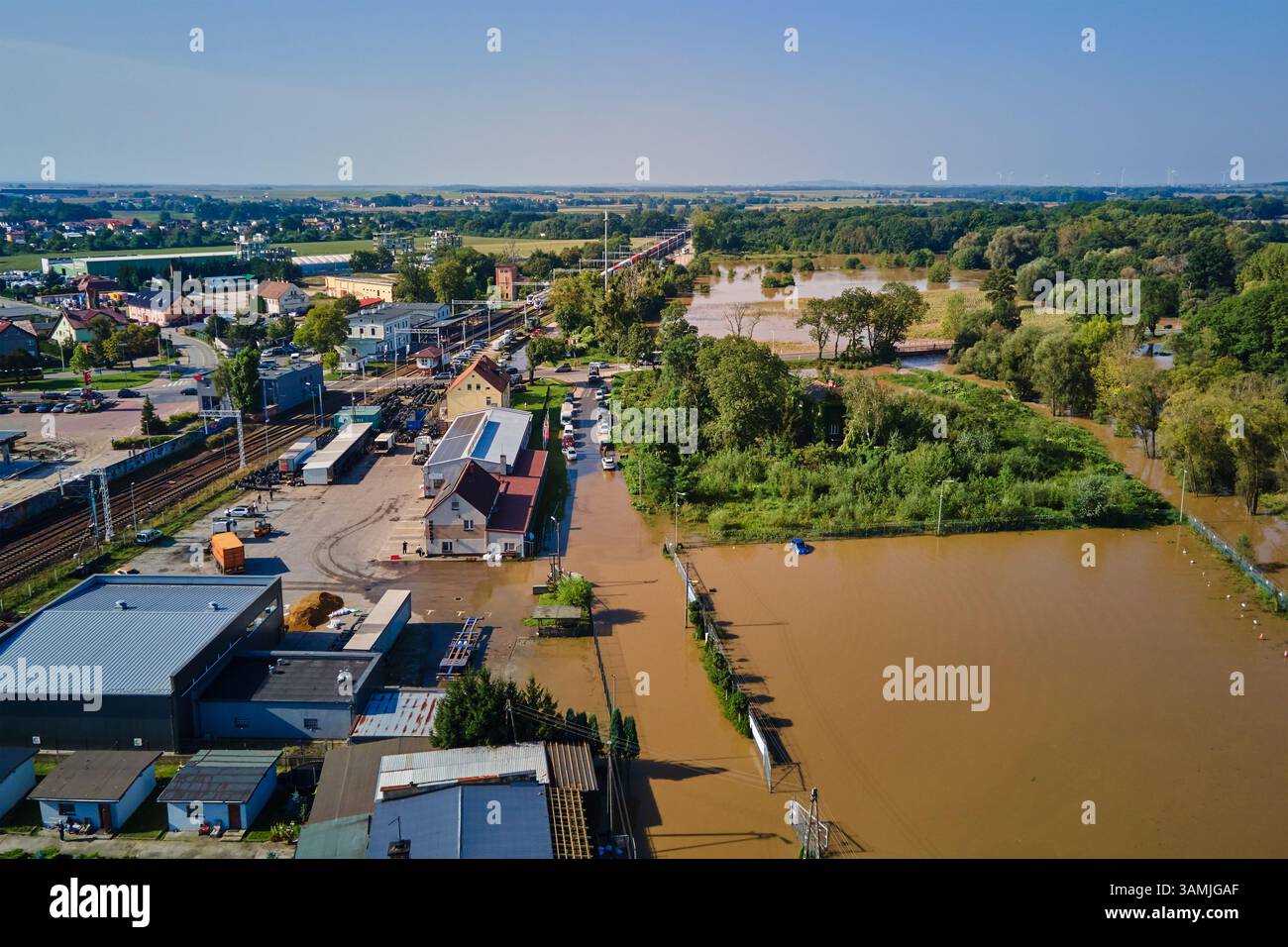 Aerial view of flooded streets, railway tracks and buildings in a ...