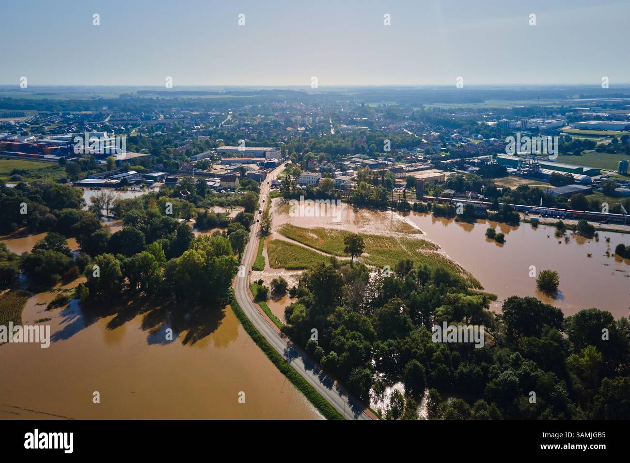 Aerial view of flooded streets, railway tracks and buildings in a ...