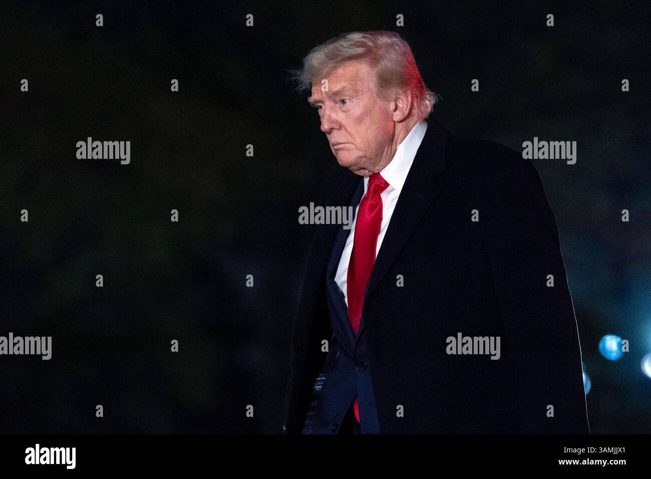 President Donald Trump walks on the South Lawn of the White House in ...
