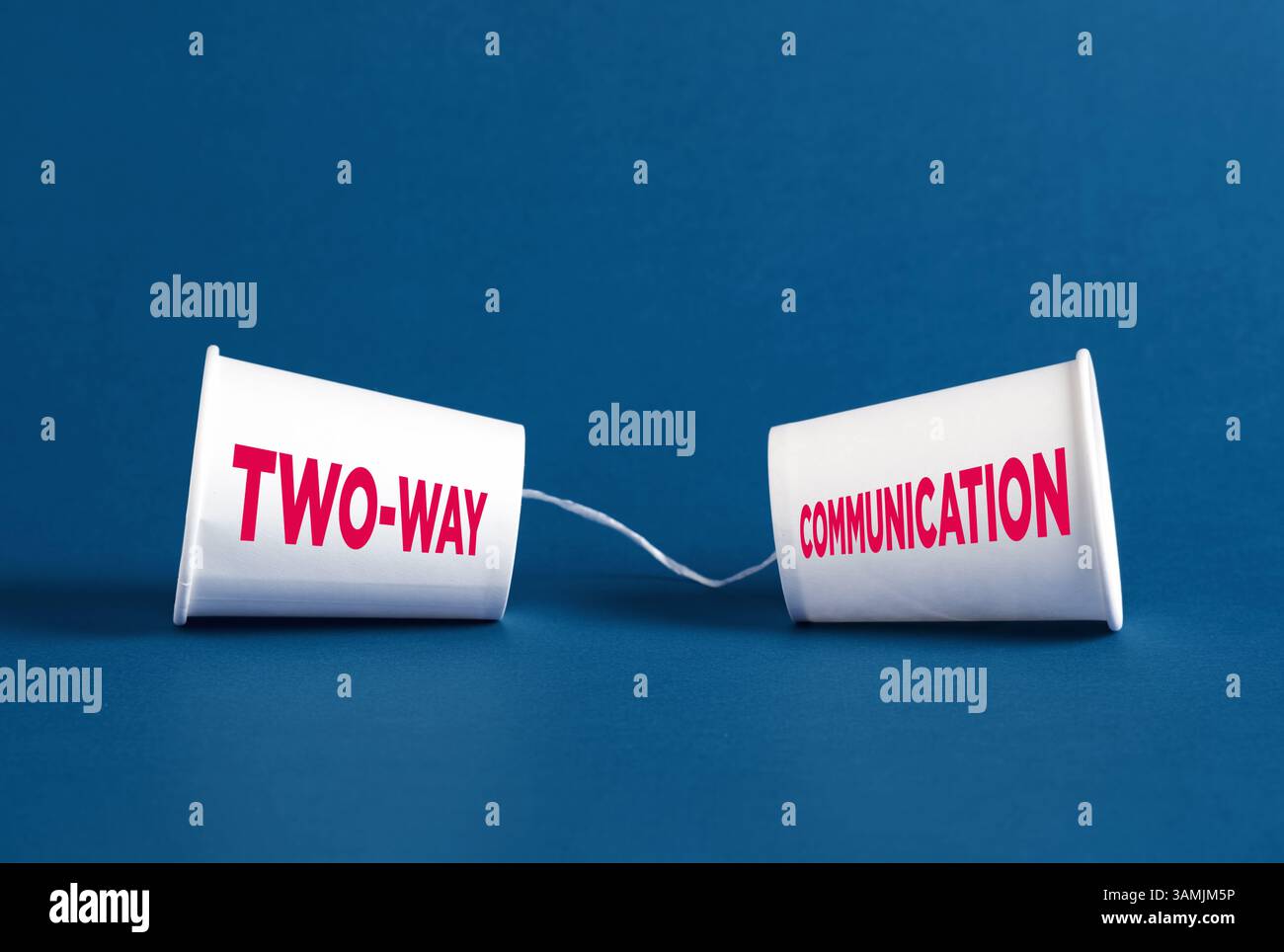 Two white paper cups connected by string represent two-way communication, conveying a clear ...