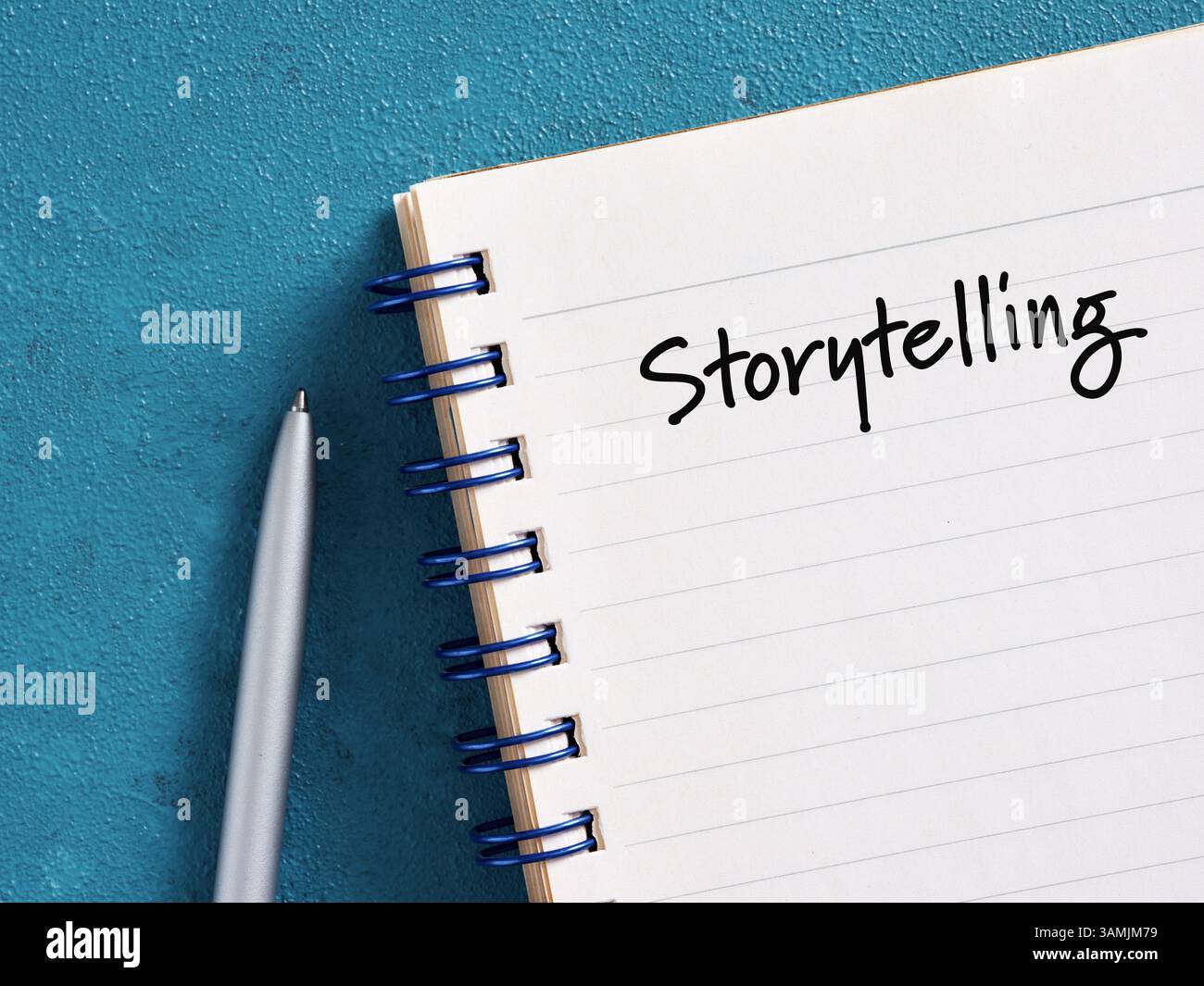 Notepad with the word storytelling handwritten on top page with a pen ...