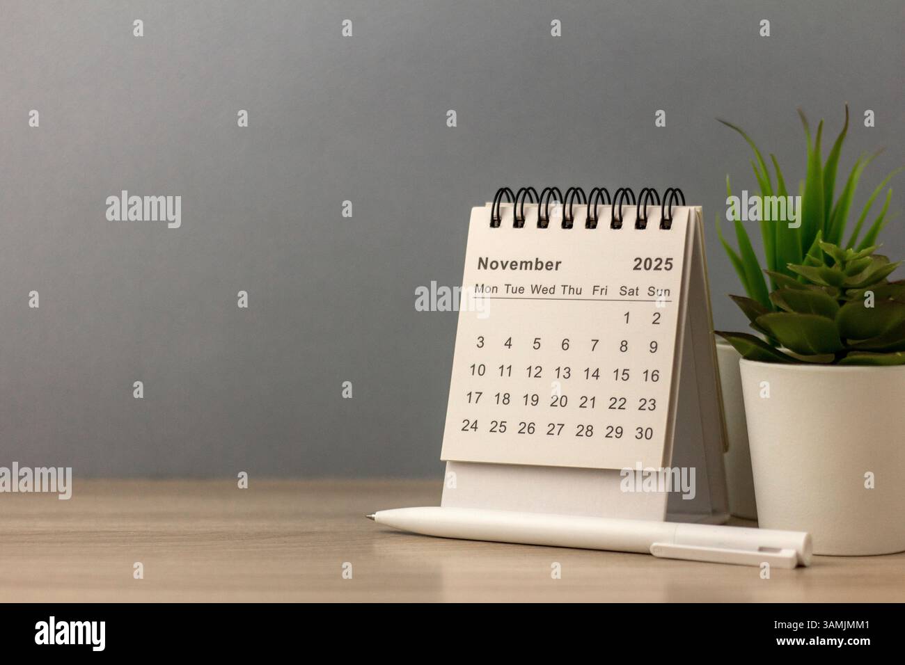 Hello, November 2025. Desktop calendar for planning on a gray ...