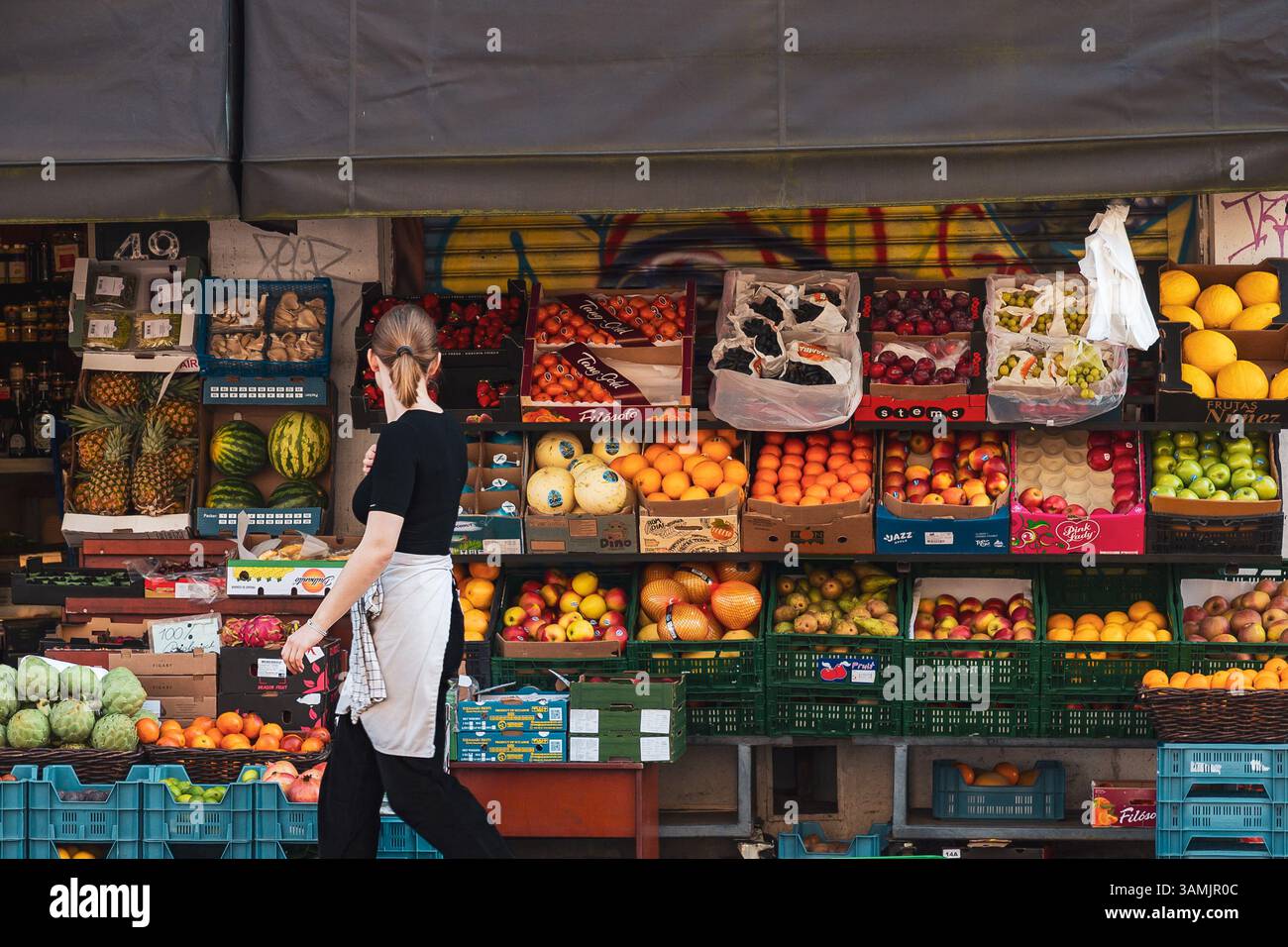 Amsterdam, Netherlands – March 27, 2025: A young woman looks at fresh ...