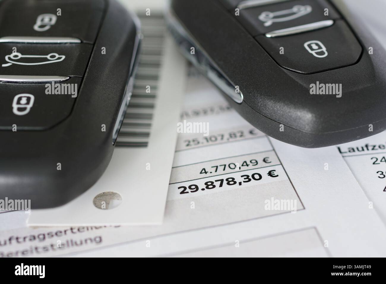Car purchase contract with car key in close-up Stock Photo - Alamy