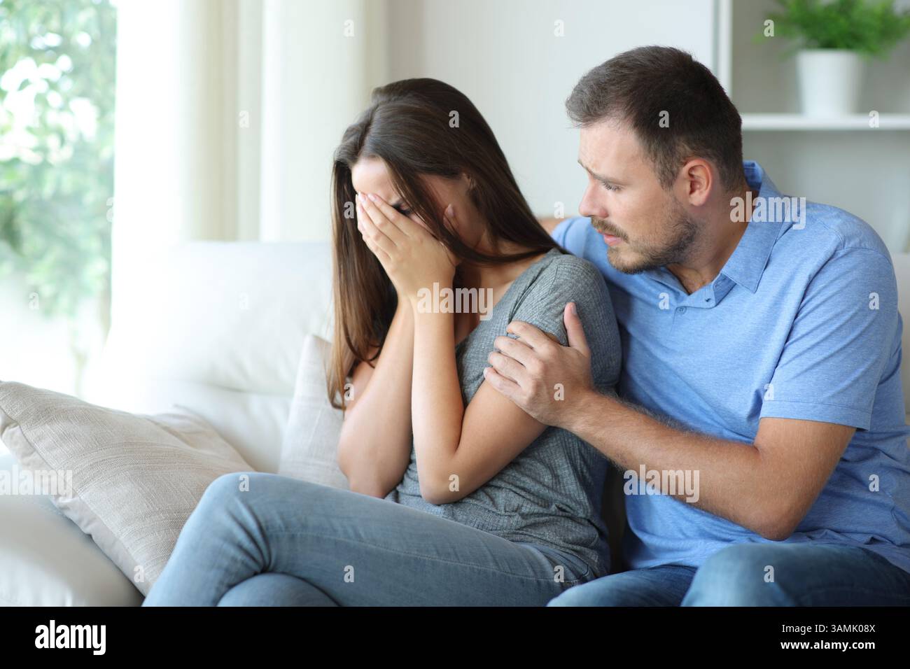Sad woman being comforted hi-res stock photography and images - Alamy