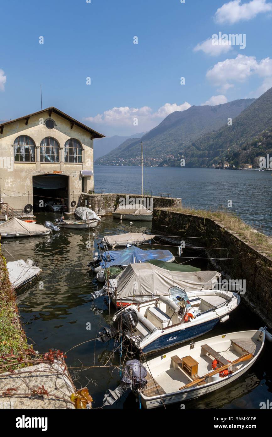 Como, Italy - April 4, 2025: A boathouse along the shore of lake Como ...