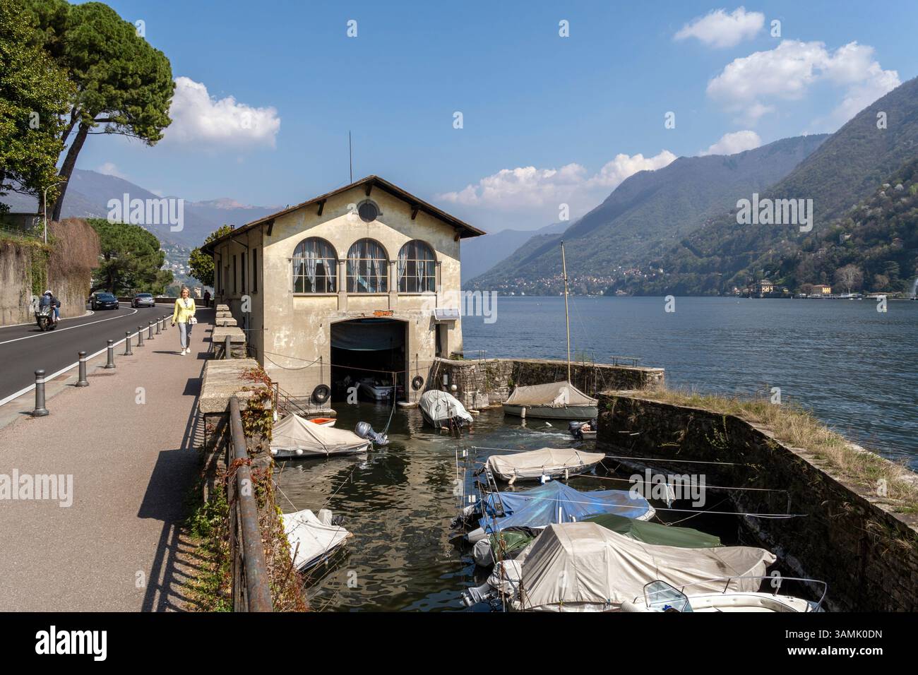 Como, Italy - April 4, 2025: A boathouse along the shore of lake Como ...
