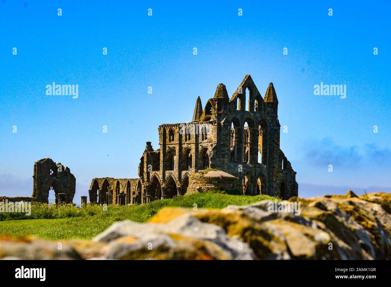 Majestic ruins of Whitby Abbey in North Yorkshire, UK, stand tall on a ...