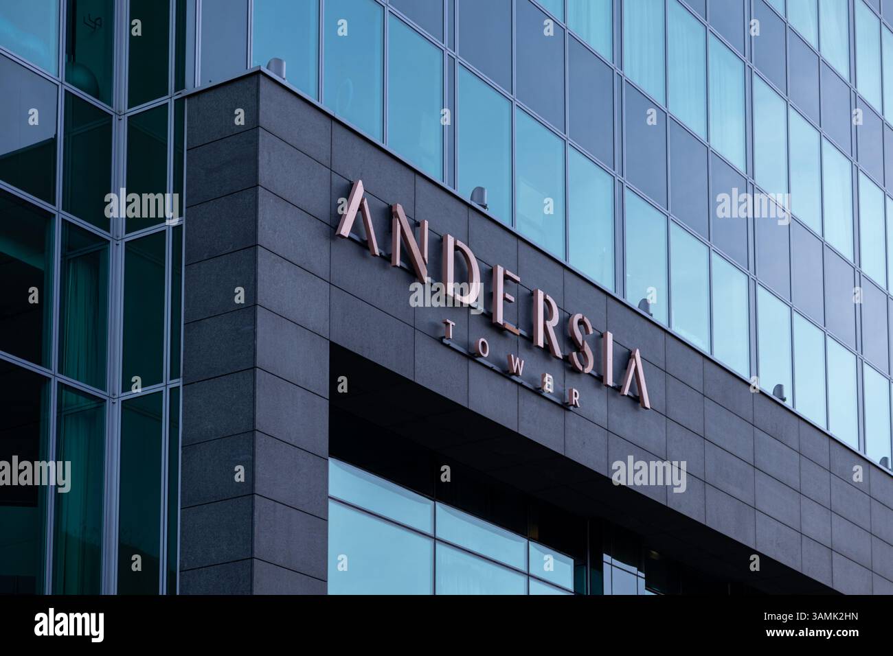 Poznan, Poland - April 8, 2025: Close-up view of Andersia Tower featuring modern glass ...