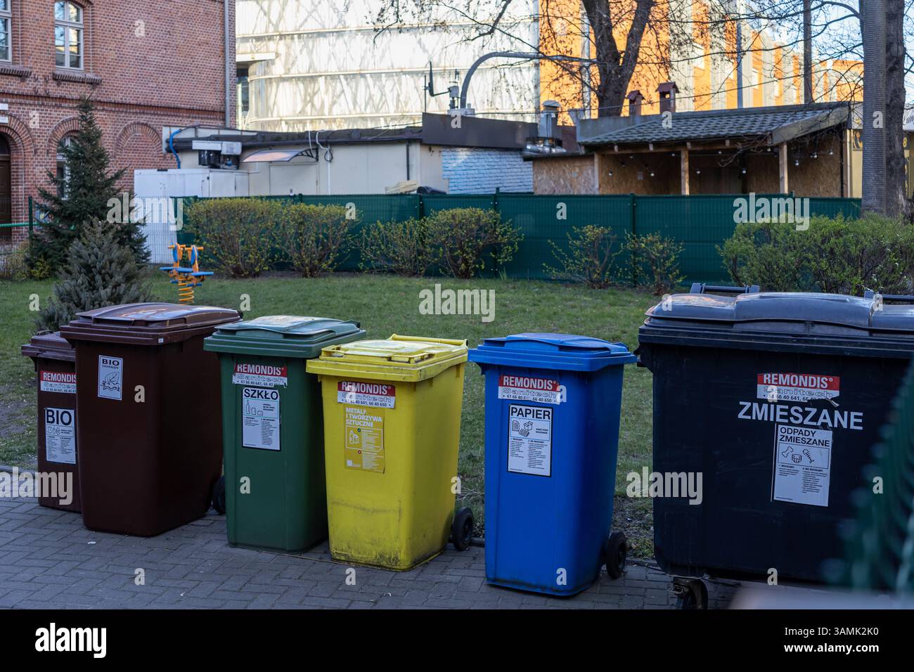 Poznan, Poland - April 8, 2025: Row of labeled recycling and waste bins ...