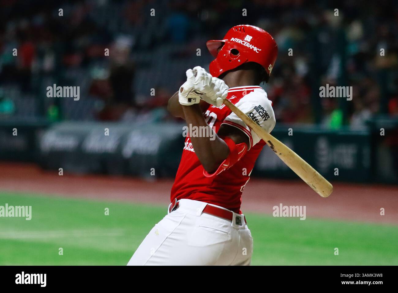 Aristides Aquino #56 of Diablos Rojos del Mexico at the bat during the ...