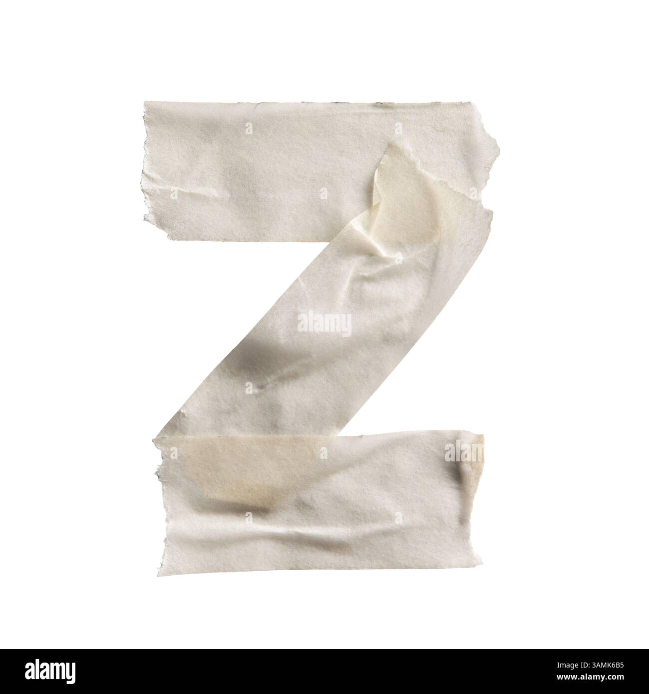 Letter Z made of off-white color masking tape on white background with ...
