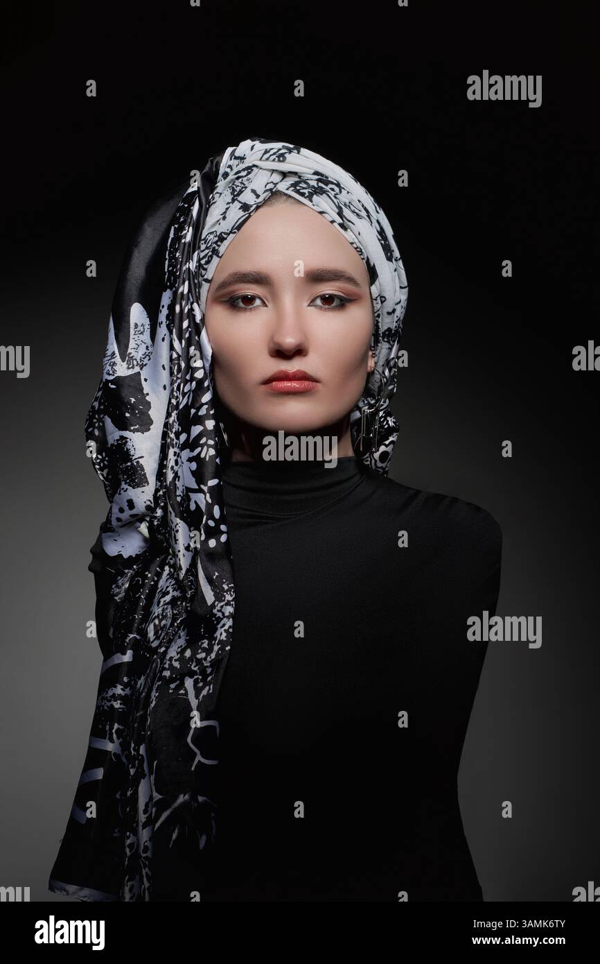 Woman wearing dark headscarf hi-res stock photography and images - Alamy