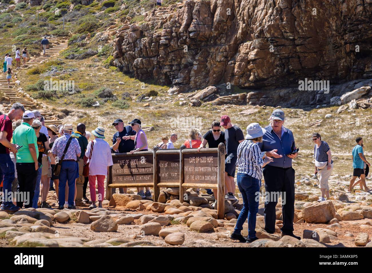 Tourists crowd round to take pictures with the iconic name sign at the ...