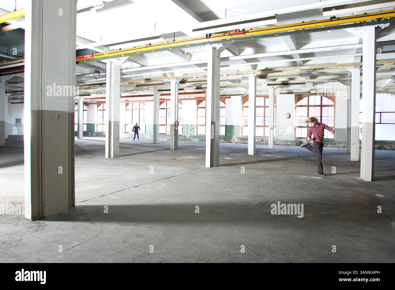 Juggling soccer balls in a warehouse, Zurich, Switzerland Stock Photo ...