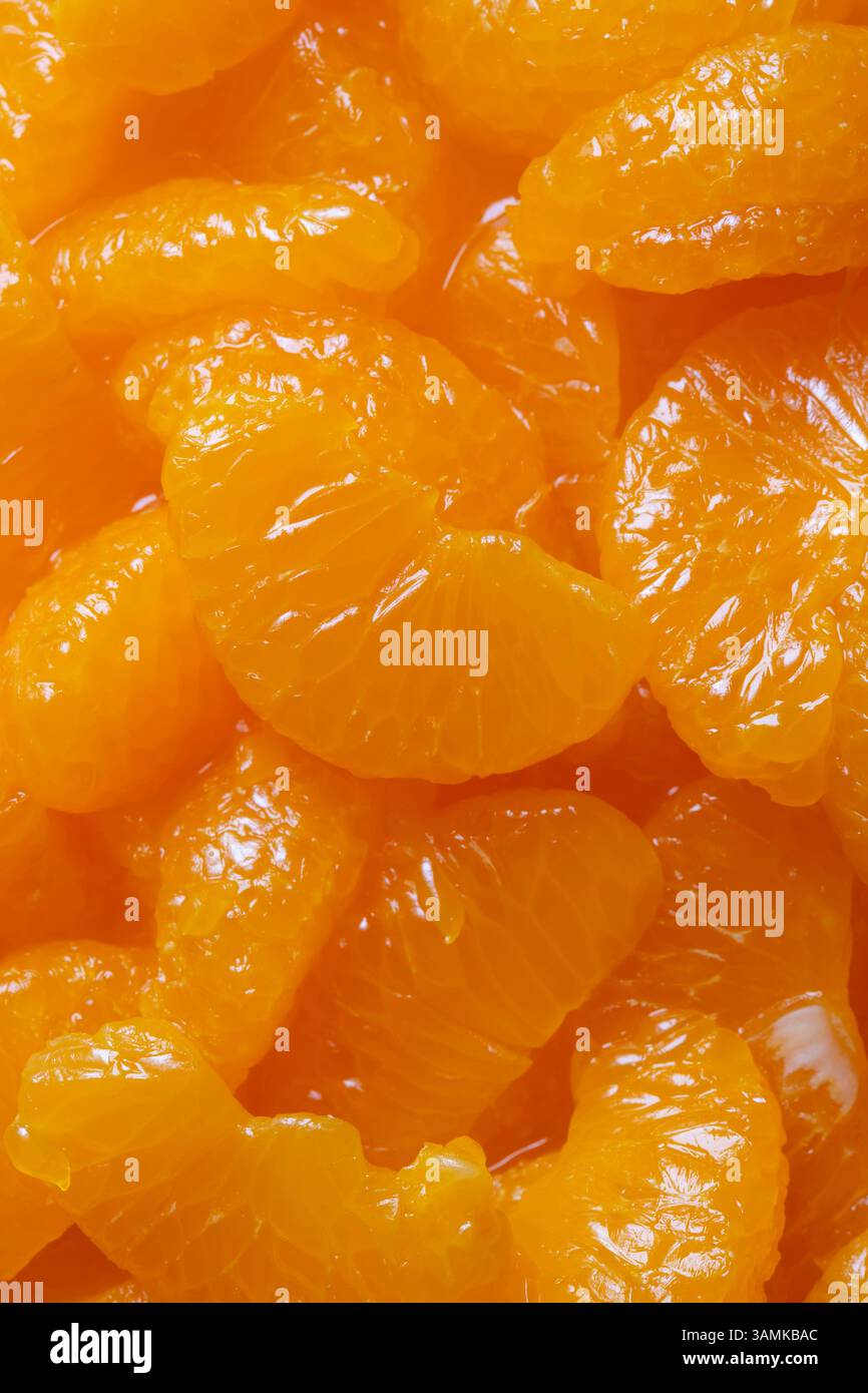 Mandarin segments in juice background backdrop. Tinned fruit food ...