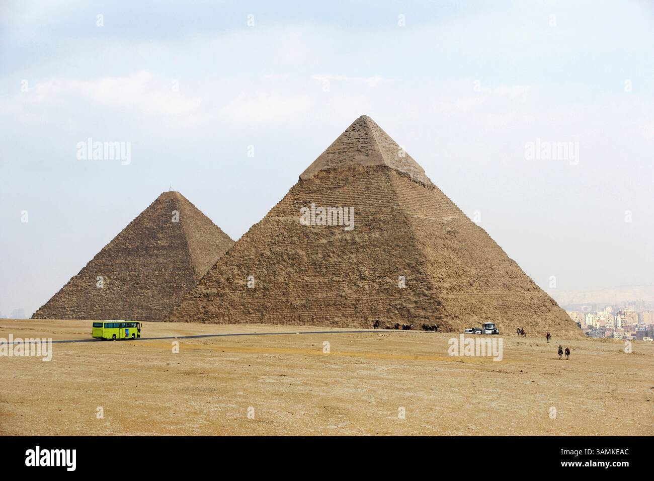 Green bus in front of Kefren og Keops Pyramids at Giza, Cairo, Egypt ...