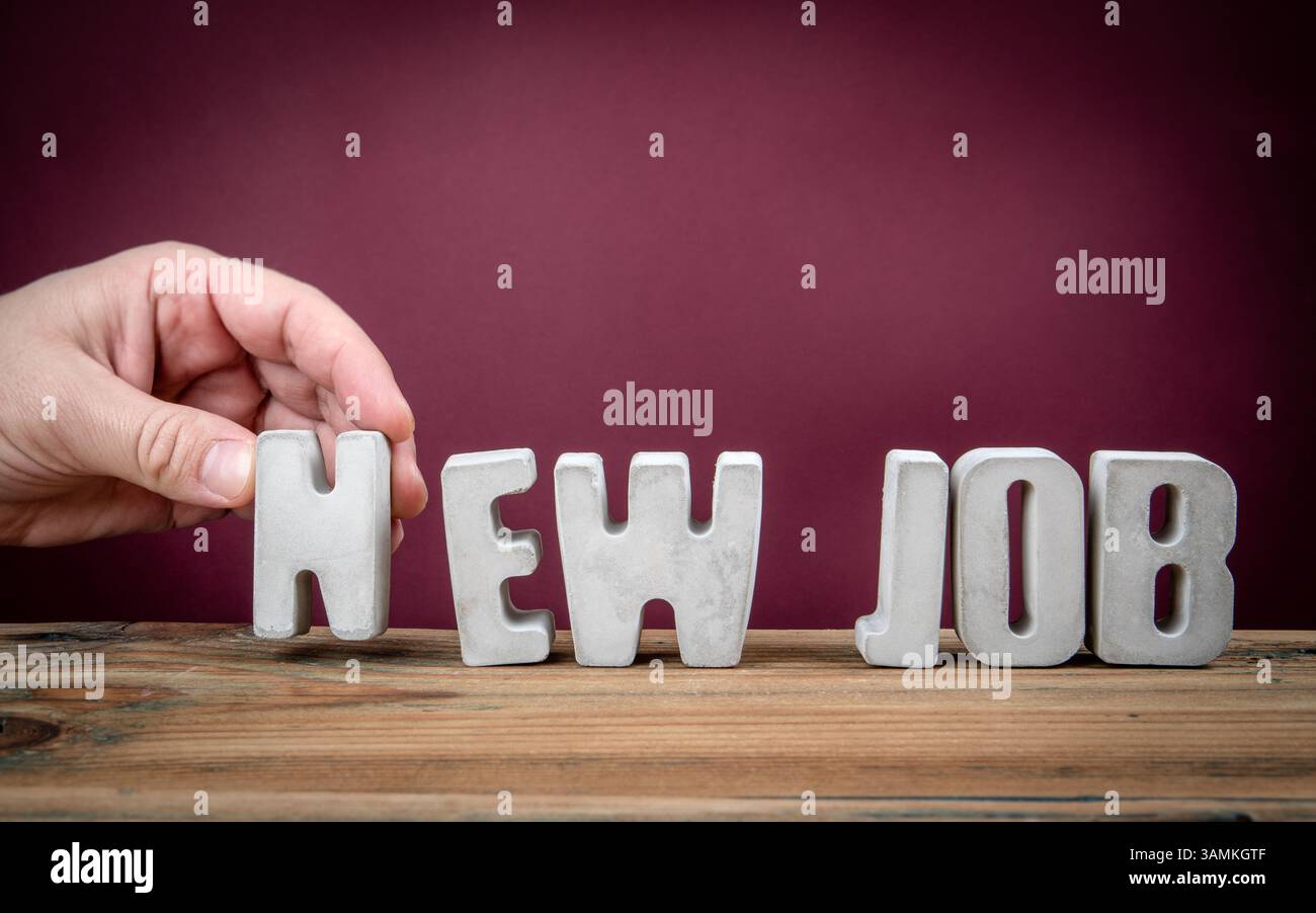 NEW JOB Word Created from Concrete Alphabet Letters on Wooden Desk ...
