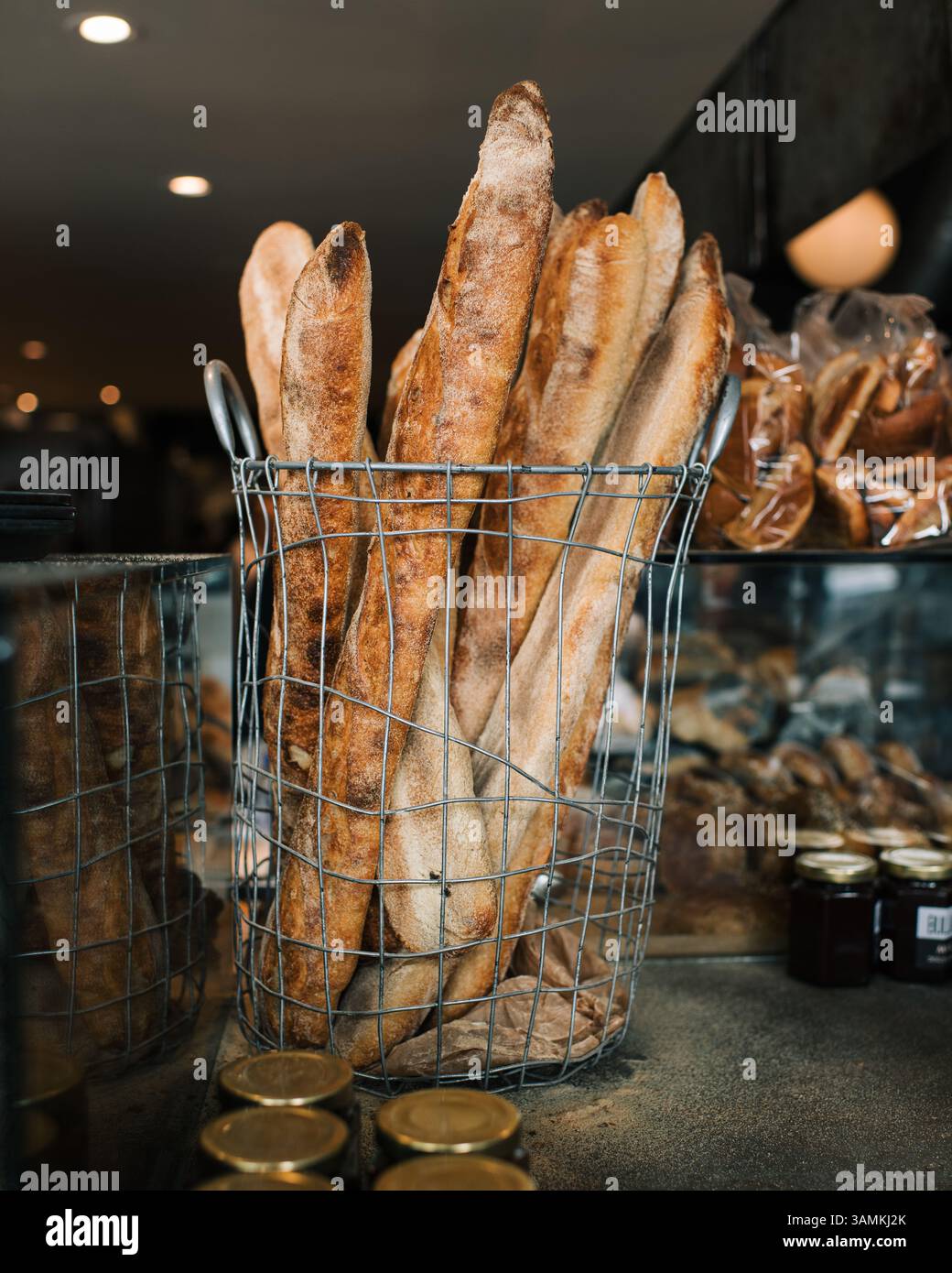 artisan sourdough french bread sticks on a countertop in a cafe Stock ...
