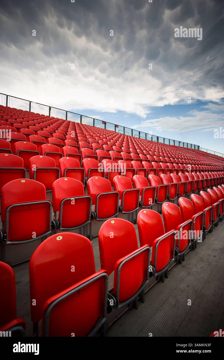 Empty red stadium seats before a sports event Stock Photo - Alamy