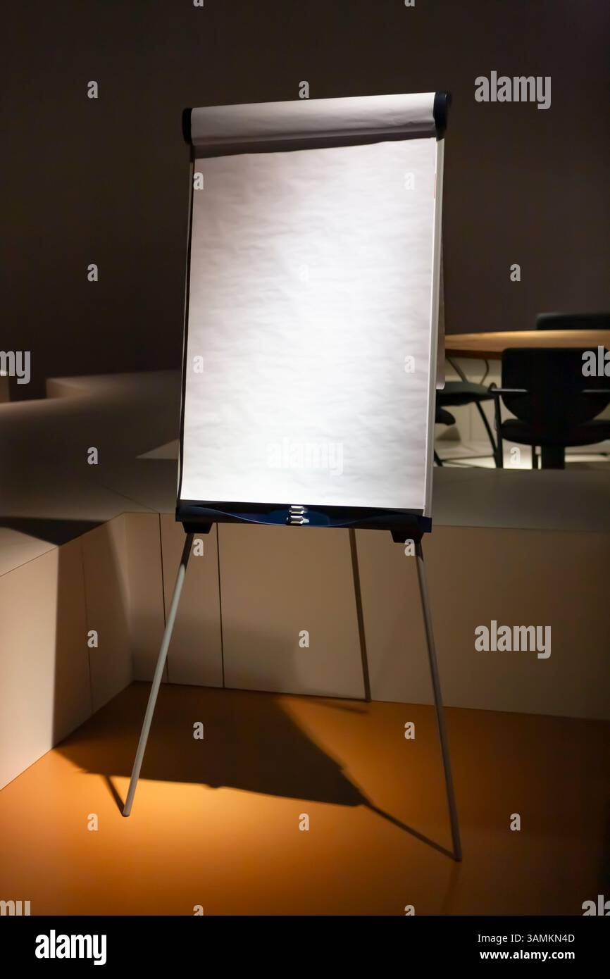 Blank White Presentation Paper on Easel in Office Setting Stock Photo ...