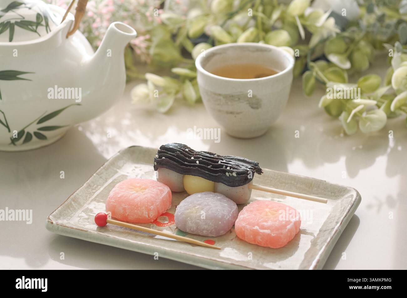 A Taste of Asia: Mooncakes, Dango, and Tea Stock Photo - Alamy
