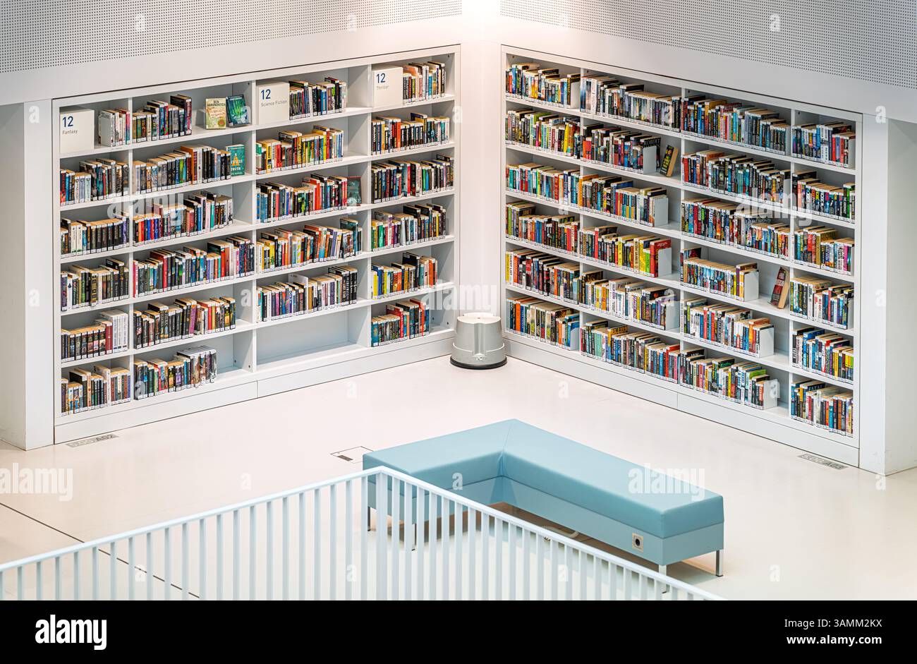 Modern library interior with extensive book collection and comfortable ...